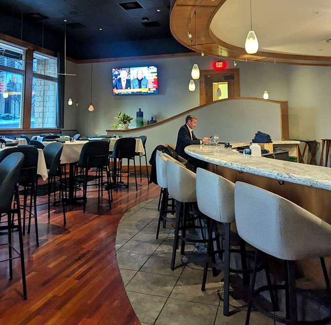 The bar area where conversations flow as smoothly as the expertly crafted cocktails being poured nightly.