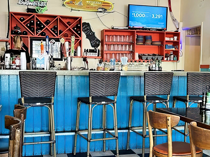 The bar area &ndash; where strangers become friends over cold drinks and fish tales. Those blue panels have heard some stories worth repeating. 
