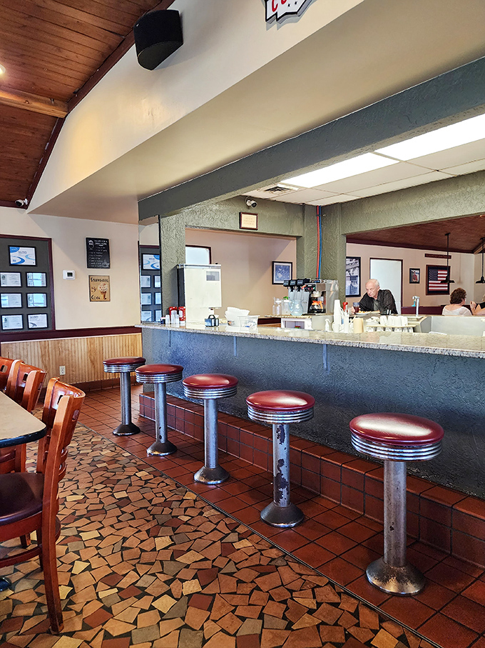 Classic counter seating where regulars have worn their loyalty into the stools, one cup of coffee and slice of pie at a time.