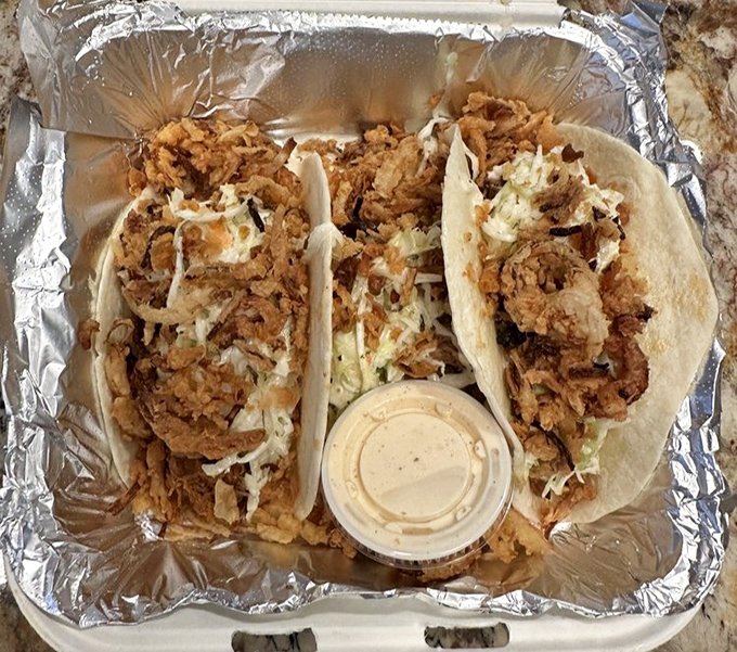 These tacos aren't messing around &ndash; stuffed with crispy protein and fresh toppings, they're the handheld happiness that makes takeout feel like a celebration.