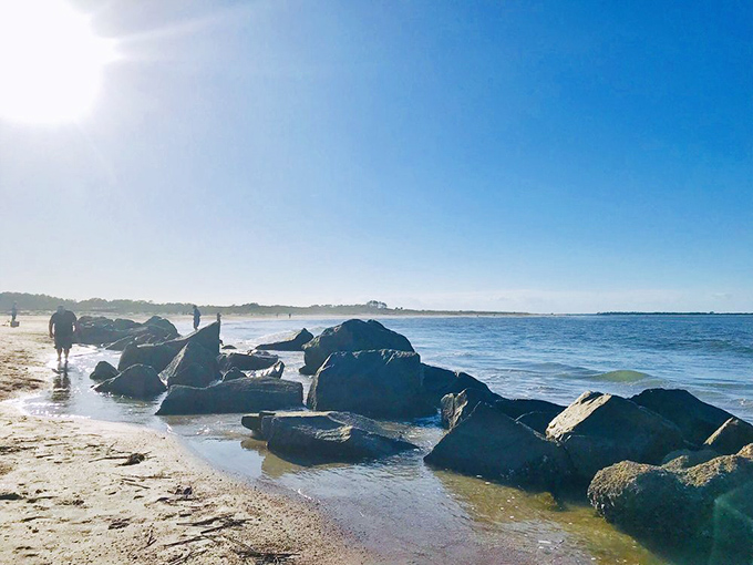 The beach where history meets recreation. Those rocks have witnessed centuries of tides, storms, and now, sunbathers seeking the perfect tan.