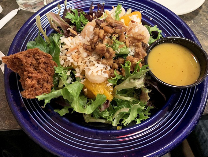 A salad that refuses to be boring &ndash; crisp greens playing host to a gathering of textures and flavors. Proof that healthy eating doesn't have to feel like punishment.