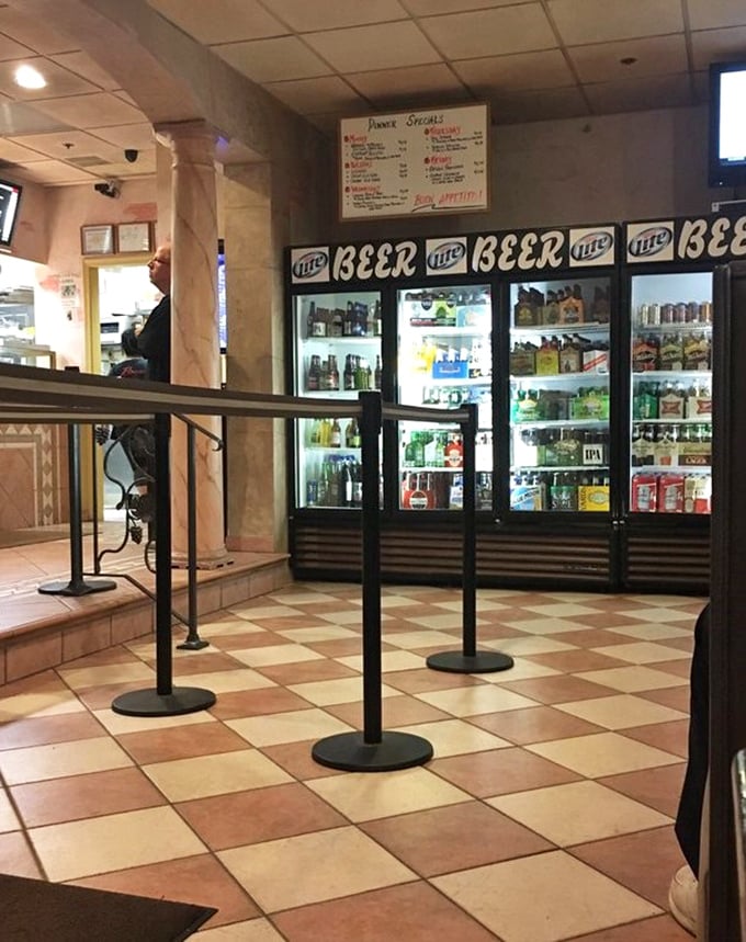 Beer coolers stocked and ready because great pizza demands cold beverages, and Rocco's understands this fundamental truth perfectly.