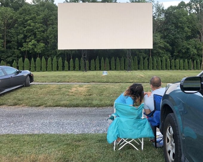 Couples settle in with blankets as twilight falls, recreating date nights from decades past with modern comfort.
