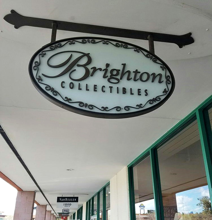 Brighton Collectibles' elegant sign swings gently overhead, like a siren song for accessory enthusiasts with discerning taste.