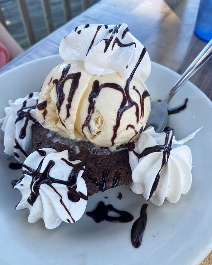A brownie sundae that's worth saving room for. Warm chocolate decadence topped with cool vanilla ice cream and chocolate drizzle—the sweet finale every meal deserves.