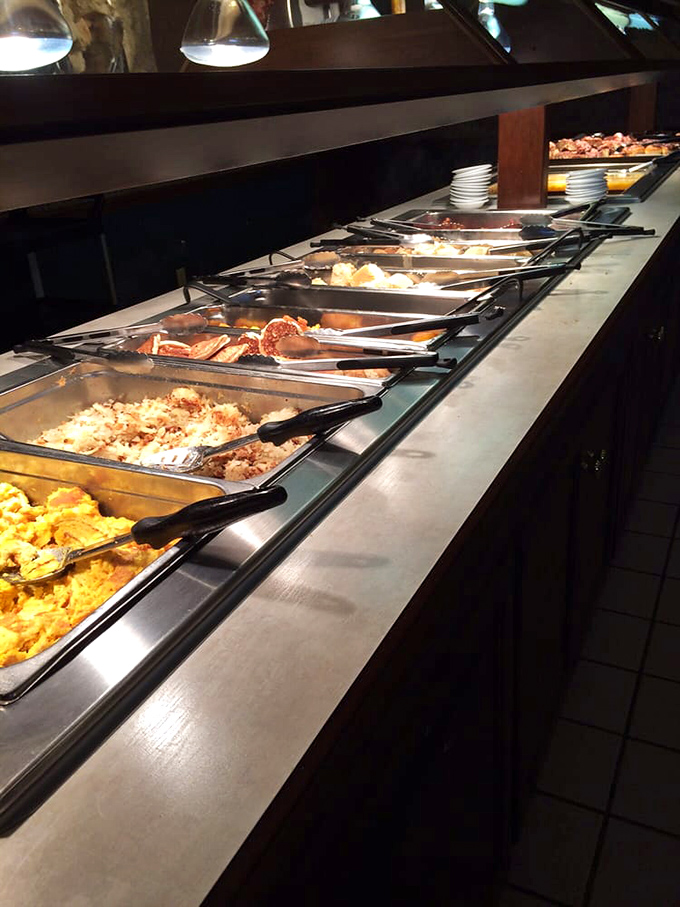 The buffet line stretches like a runway of homestyle delights, where each steam tray holds another reason to regret wearing pants without an elastic waistband.