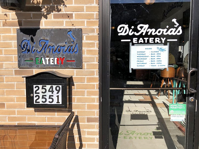 The door that promises Italian delights within &ndash; those hours posted are basically your weekly schedule now.