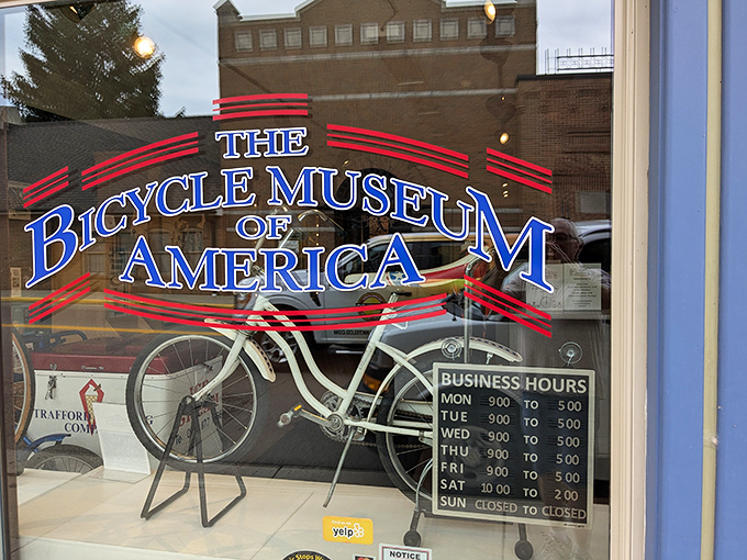 The welcoming storefront announces the Bicycle Museum of America with vintage flair, promising visitors a spin through cycling history six days a week.