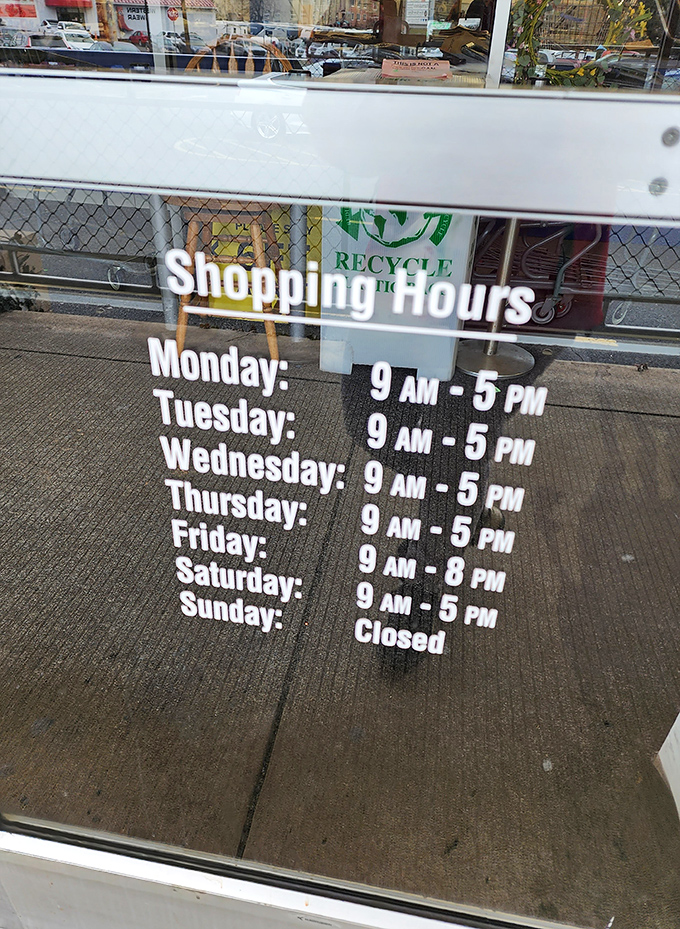 The store hours posted clearly for planning your thrifting adventures&mdash;a considerate touch for those who organize their treasure hunting expeditions.