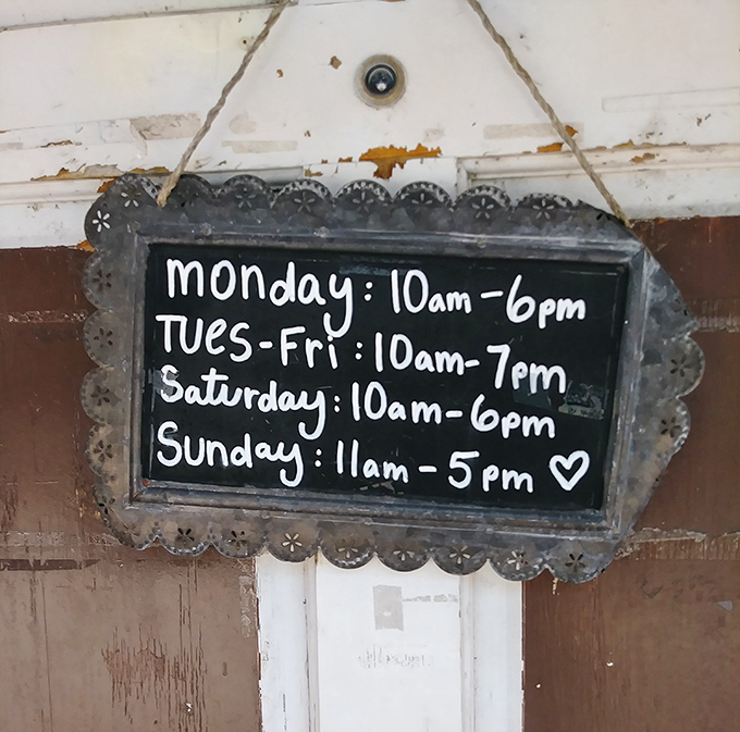 Store hours presented with charming imperfection&mdash;the little heart at the end suggests they're not just selling stuff, they're sharing love.