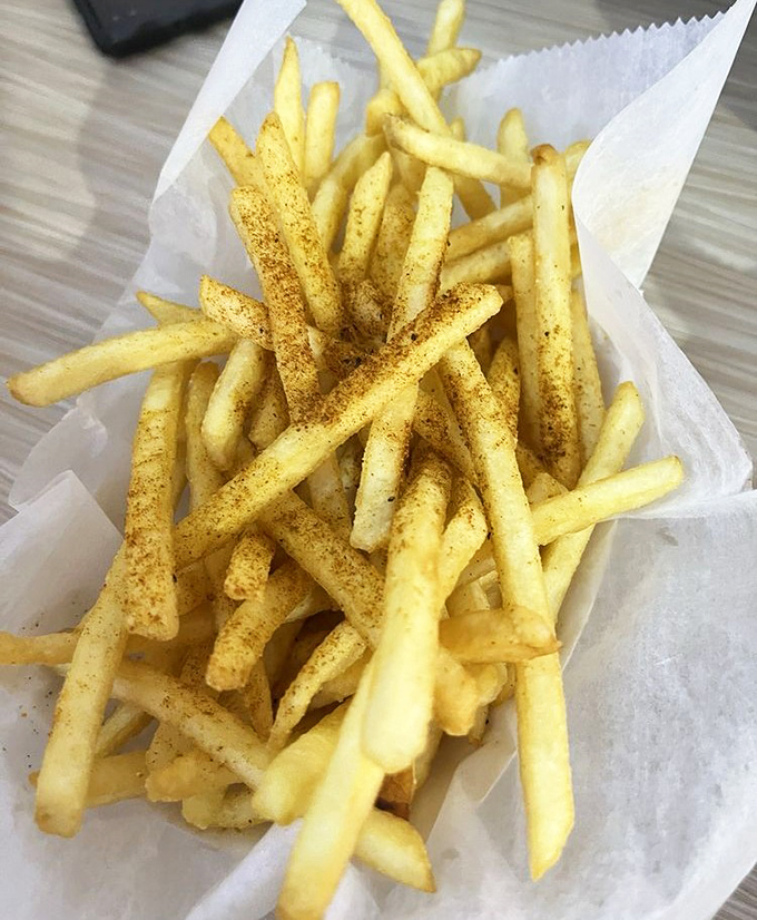 These aren't just fries; they're golden wands of potato perfection dusted with Cajun magic &ndash; crispy on the outside, fluffy within.