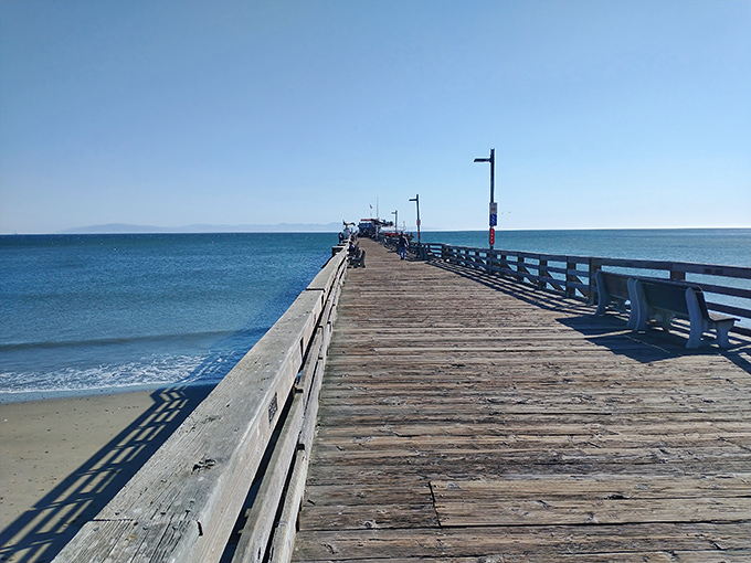 The wooden planks of Capitola Wharf lead visitors on a journey into the bay, where the horizon promises adventures and the shoreline beckons you home.