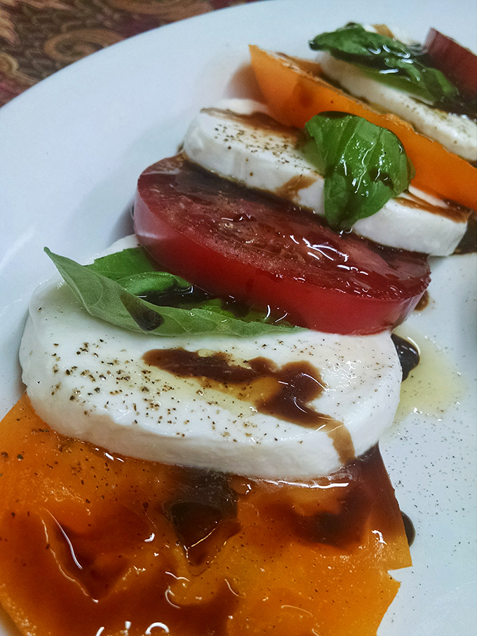 This isn't just a Caprese salad&mdash;it's summer on a plate, where tomatoes and mozzarella perform a perfectly choreographed dance drizzled with balsamic reduction.