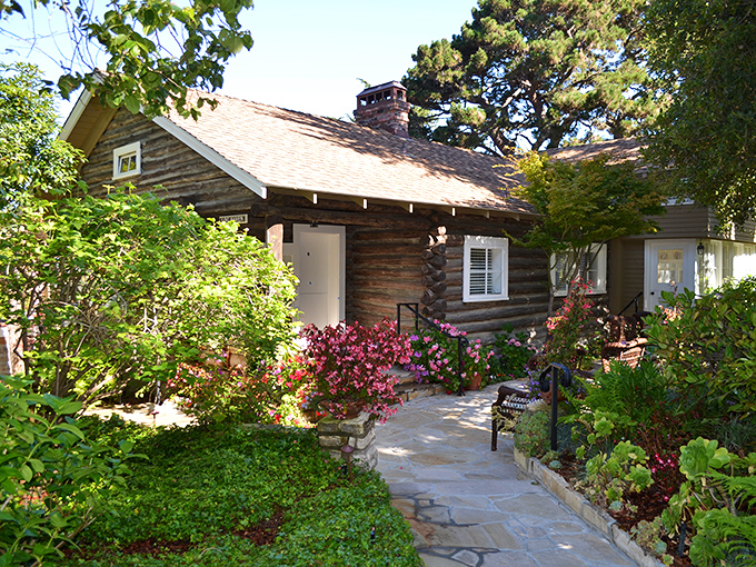 A cottage that looks like it was plucked straight from a storybook, complete with the kind of garden that makes you want to take up horticulture.