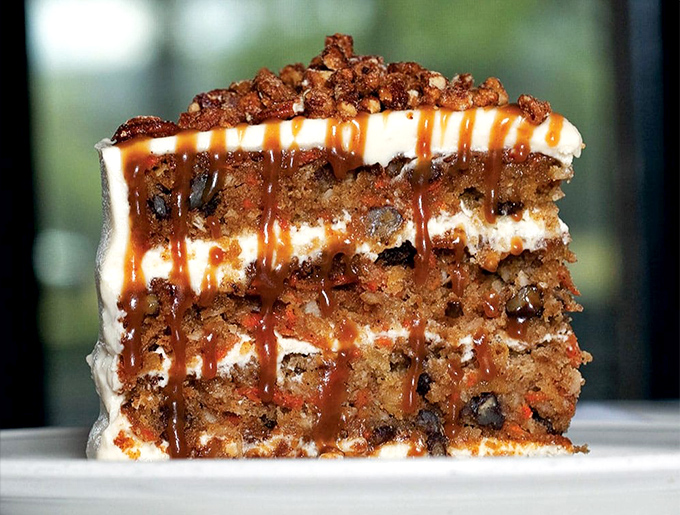 A carrot cake that makes vegetables feel like they've finally made it to the big leagues. Layers of happiness separated by cream cheese frosting.