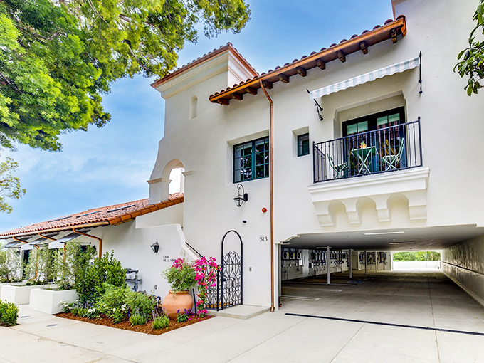 Bougainvillea cascades against pristine white walls in classic Santa Barbara style. This residential architecture proves that everyday buildings can be extraordinary.