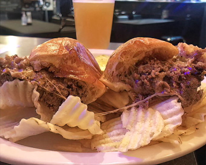 A cheesesteak that crossed state lines and decided to stay, making friends with crispy potato chips along the way.