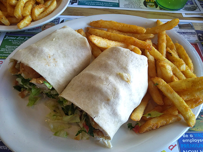 A wrap so perfectly constructed it could teach engineering classes, filled with chicken fingers and fresh vegetables in portable perfection.