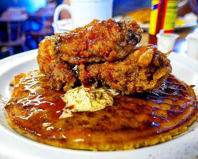 Chicken and waffles: the breakfast-dinner hybrid that proves some relationships are meant to be. That syrup pool is basically liquid happiness.
