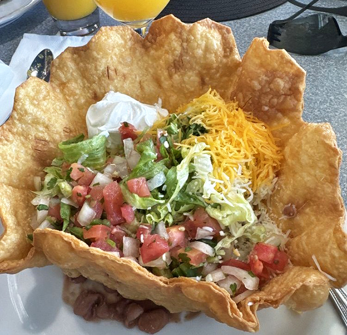 Taco salad served in its own edible fortress of fried tortilla. It's like someone said, "Let's make salad fun," and then actually succeeded!