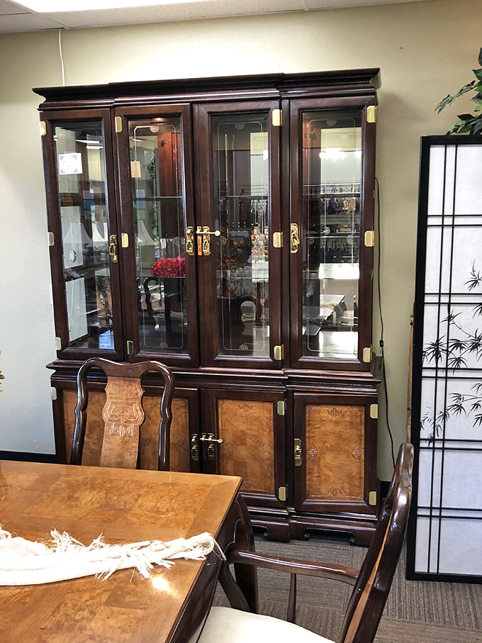 China cabinet that's more dignified than most people you know. Those glass doors have protected fine dinnerware through decades of special occasions.