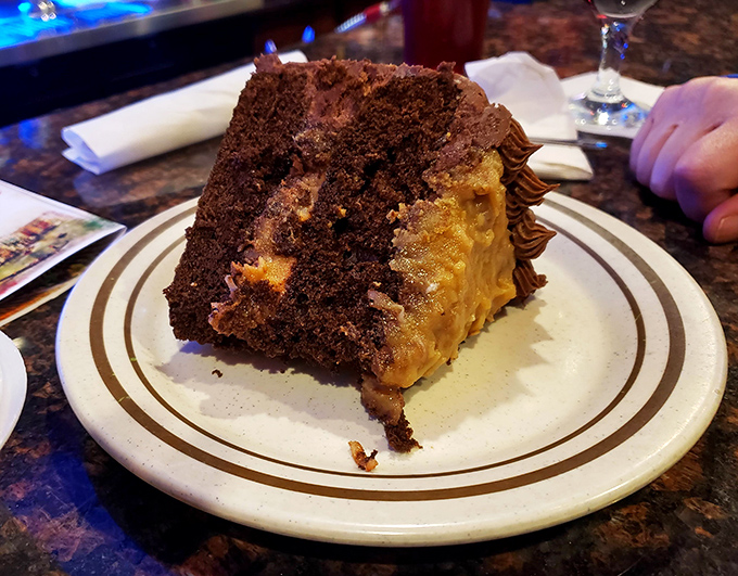 This chocolate cake isn't just dessert—it's the final act in a three-act play about why elastic waistbands were invented. Worth every calorie-counting negotiation.