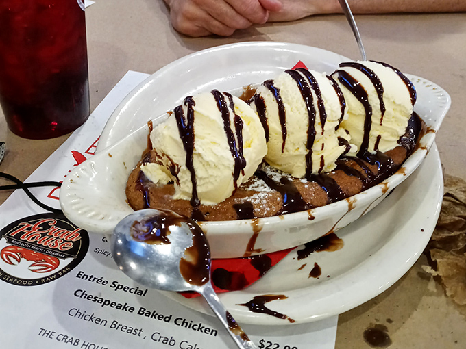 This warm cookie crowned with ice cream and chocolate drizzle isn't just dessert&mdash;it's the sweet finale to a seafood symphony. Spoons ready for the standing ovation!