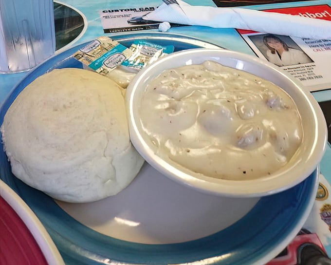 Clam chowder thick enough to stand a spoon in, served with a pillowy biscuit that's begging to take a dive.