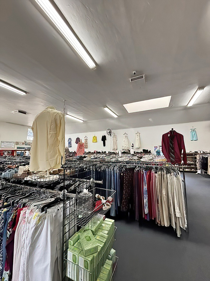 Racks upon racks of carefully organized clothing create a secondhand department store experience where patience rewards the persistent bargain hunter.