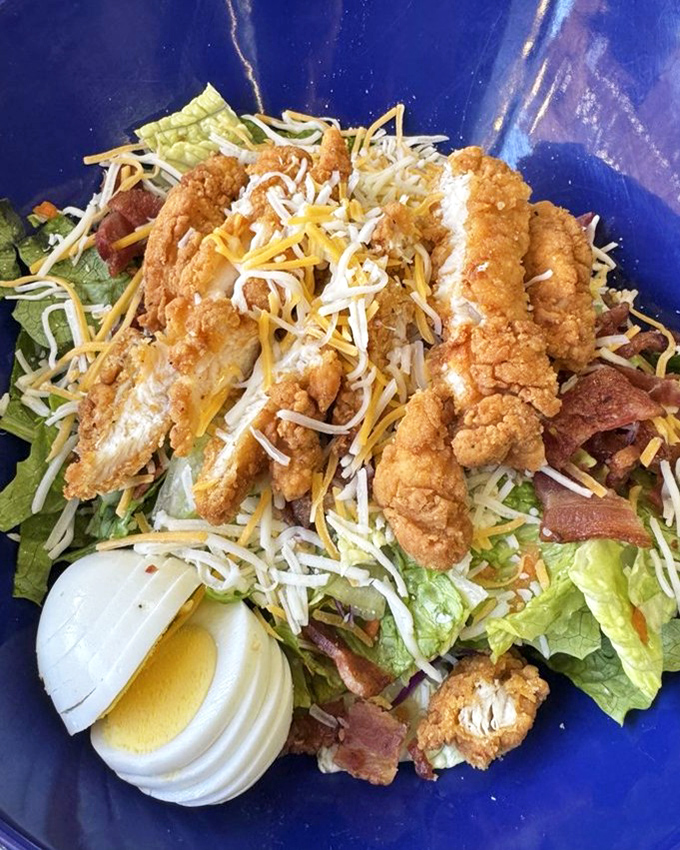 A Cobb salad that understands the assignment&mdash;crispy chicken, generous bacon, and perfect hard-boiled egg arranged like edible art.