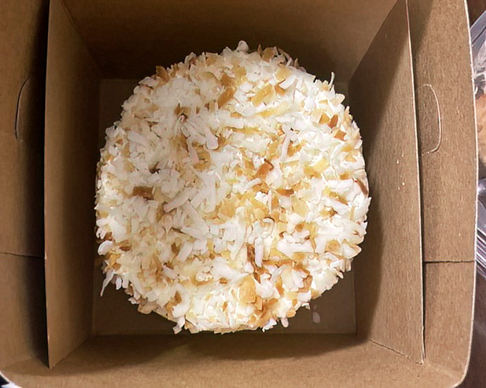 This coconut cake in its humble box is the dessert equivalent of Clark Kent &ndash; unassuming packaging hiding something truly super inside.