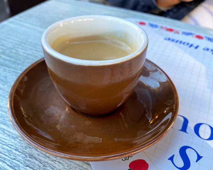 A simple cup of coffee in a brown cup &ndash; the unsung hero of every great breakfast experience, ready to bring you back to life one sip at a time.