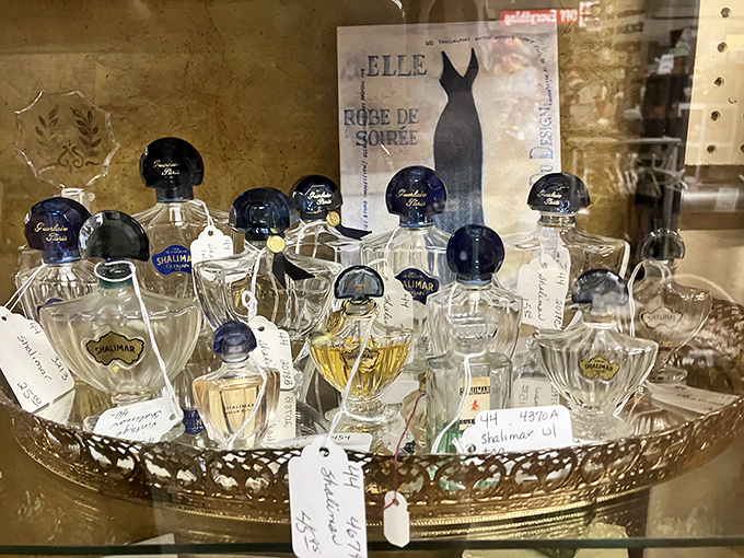 Perfume bottles that once graced elegant vanities now await collectors with discerning noses. Shalimar's distinctive blue caps stand out like sapphires among glass.