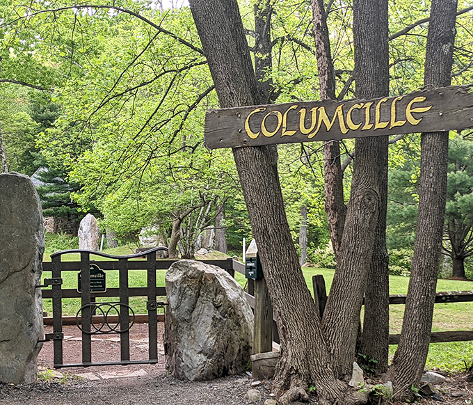 A rustic wooden sign marks the entrance to this mystical realm. Like finding the wardrobe to Narnia, but with better parking options.