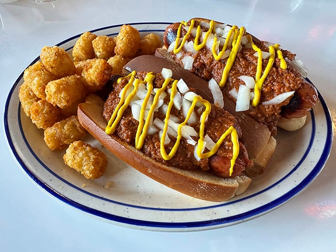 Hot dogs dressed to impress with chili, onions, and mustard zigzags. Paired with tater tots that achieve the golden-brown perfection we all aspire to.