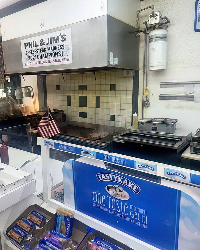 Behind the scenes where champions are made. That "2021 Cheesesteak Madness Champions" sign isn't just decoration&mdash;it's a well-earned trophy.