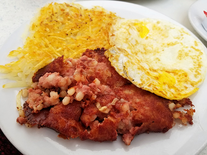 Corned beef hash with eggs and hash browns&mdash;the breakfast of champions who plan to nap by noon. A beautiful symphony of textures and savory flavors.