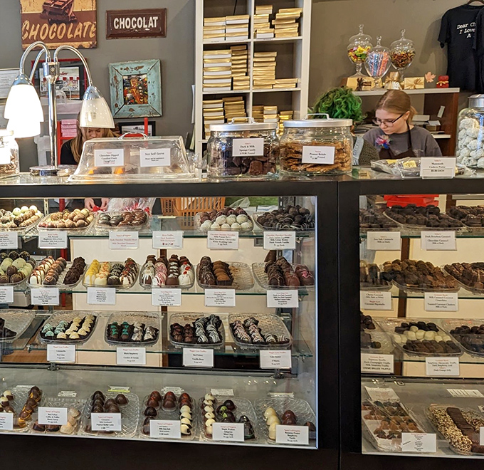 Behind this glass lies proof that chocolate deserves its own art gallery, with truffles so beautiful they should come with their own tiny velvet ropes.