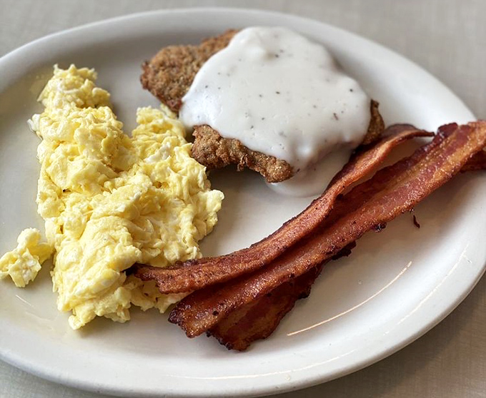 Country fried steak smothered in gravy that could make a vegetarian question their life choices. Comfort food that hugs you from the inside.