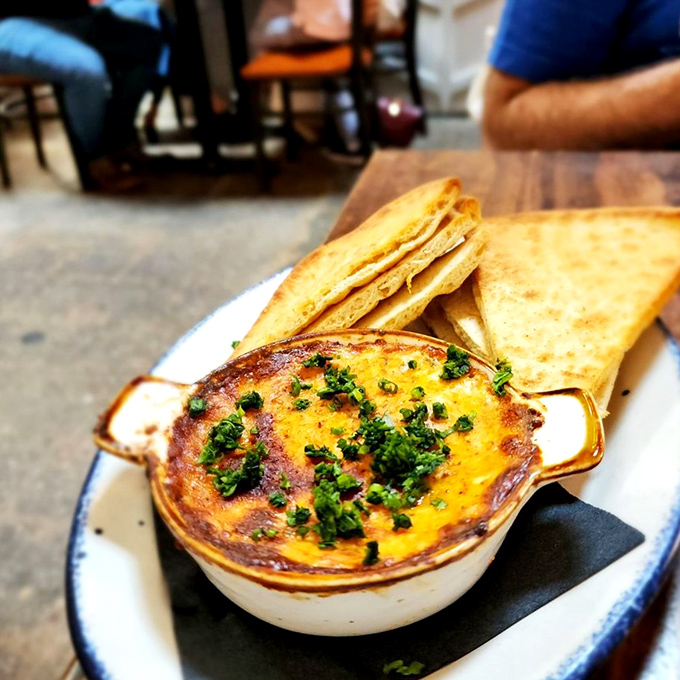 Bubbling hot crab dip with crispy toast points&mdash;because sometimes you need a break from lobster rolls. (But just a short one.)