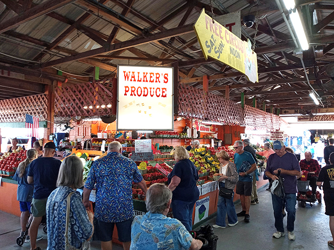 Happy hunters navigate produce paradise where Walker's fresh offerings draw crowds like magnets to quality goodness.