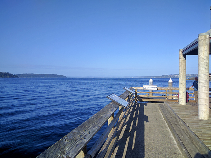 The deck extends over Puget Sound like a promise of adventure. This isn't just a walkway—it's where land meets sea meets appetite.