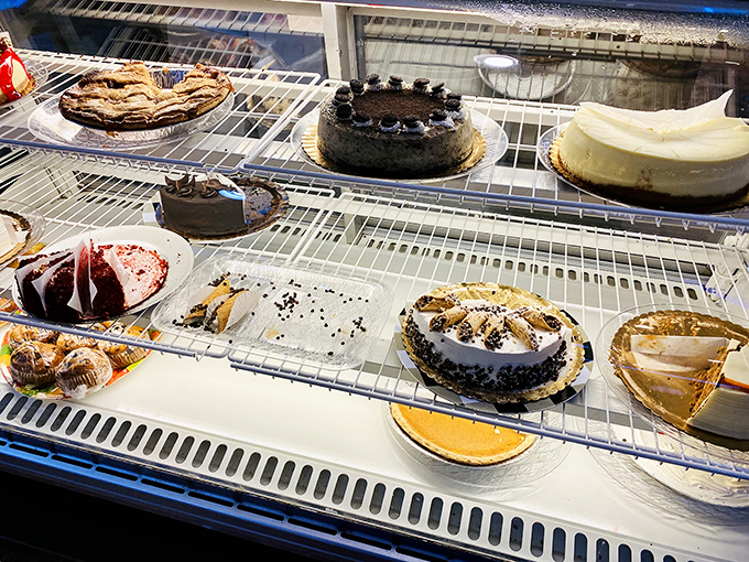 The dessert case—where willpower goes to die and "I'll just have a bite" becomes the biggest lie you'll tell yourself today.