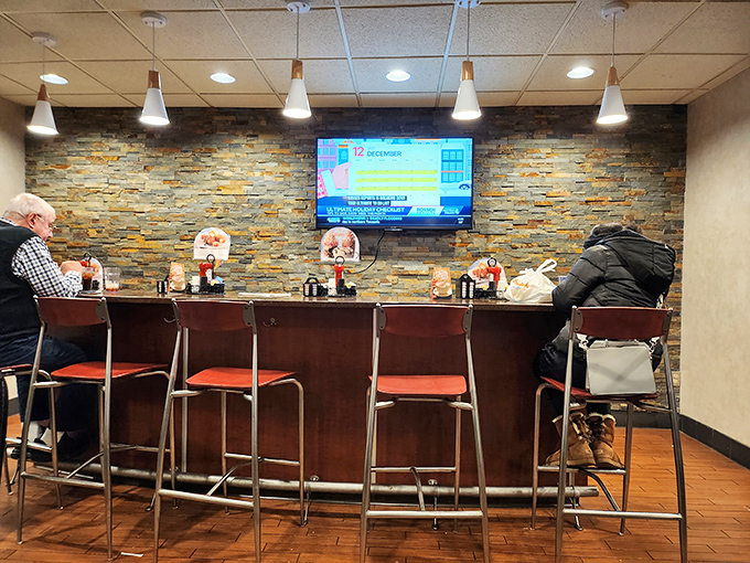 The counter seating area offers front-row tickets to the kitchen symphony, where regulars perch like seasoned critics at a show they've loved for decades.