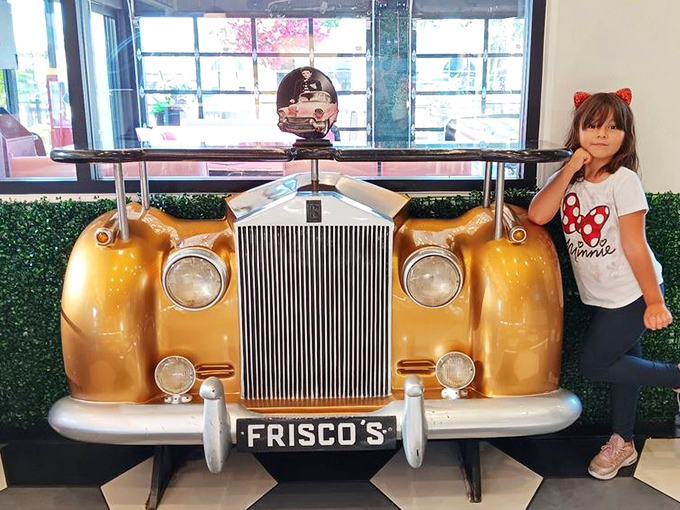 A golden vintage car display that serves as both decor and photo opportunity. Frisco's understands that we eat with our eyes first, memories second.
