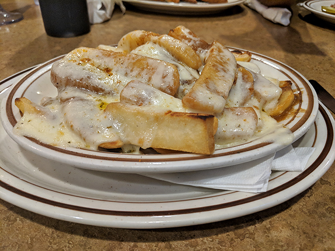 Disco fries&mdash;the glorious marriage of crispy potatoes, melted cheese, and gravy that makes you wonder why you'd eat fries any other way.