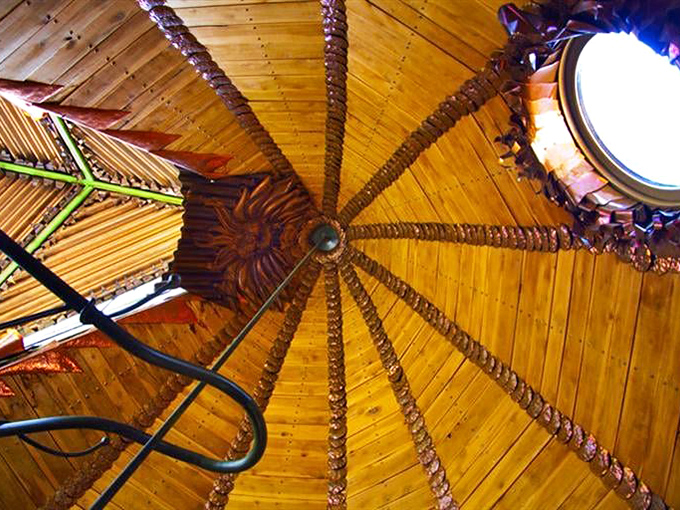 Looking up at the dome ceiling reveals intricate wooden beams radiating from the center, like the gills of a mushroom turned architectural marvel.