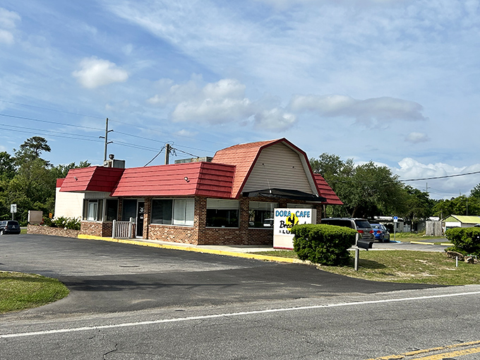 Dora Cafe's distinctive red roof signals classic diner comfort food&mdash;the kind of place where locals gather and visitors wish they were locals.