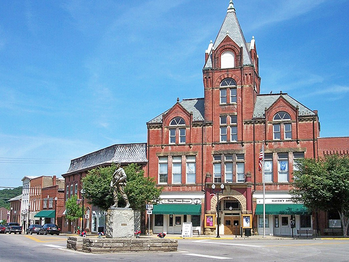 Downtown McConnelsville's red brick buildings and central monument create a town square that feels both timeless and alive with community spirit.